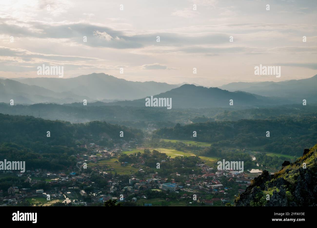 View of the mist-covered mountains of Tana Toraja seen from the top of ...