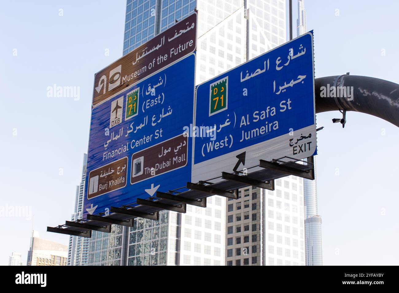 Road signs in Dubai on Sheikh Zayed Road. Bilingual in Arabic and ...