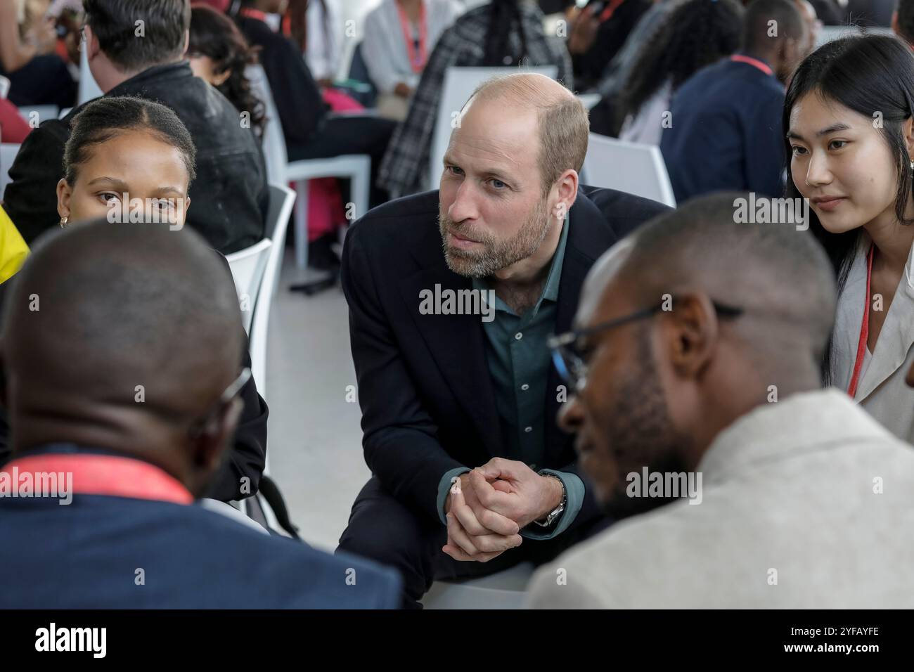 Britain's Prince William listens to a group of young people at the ...