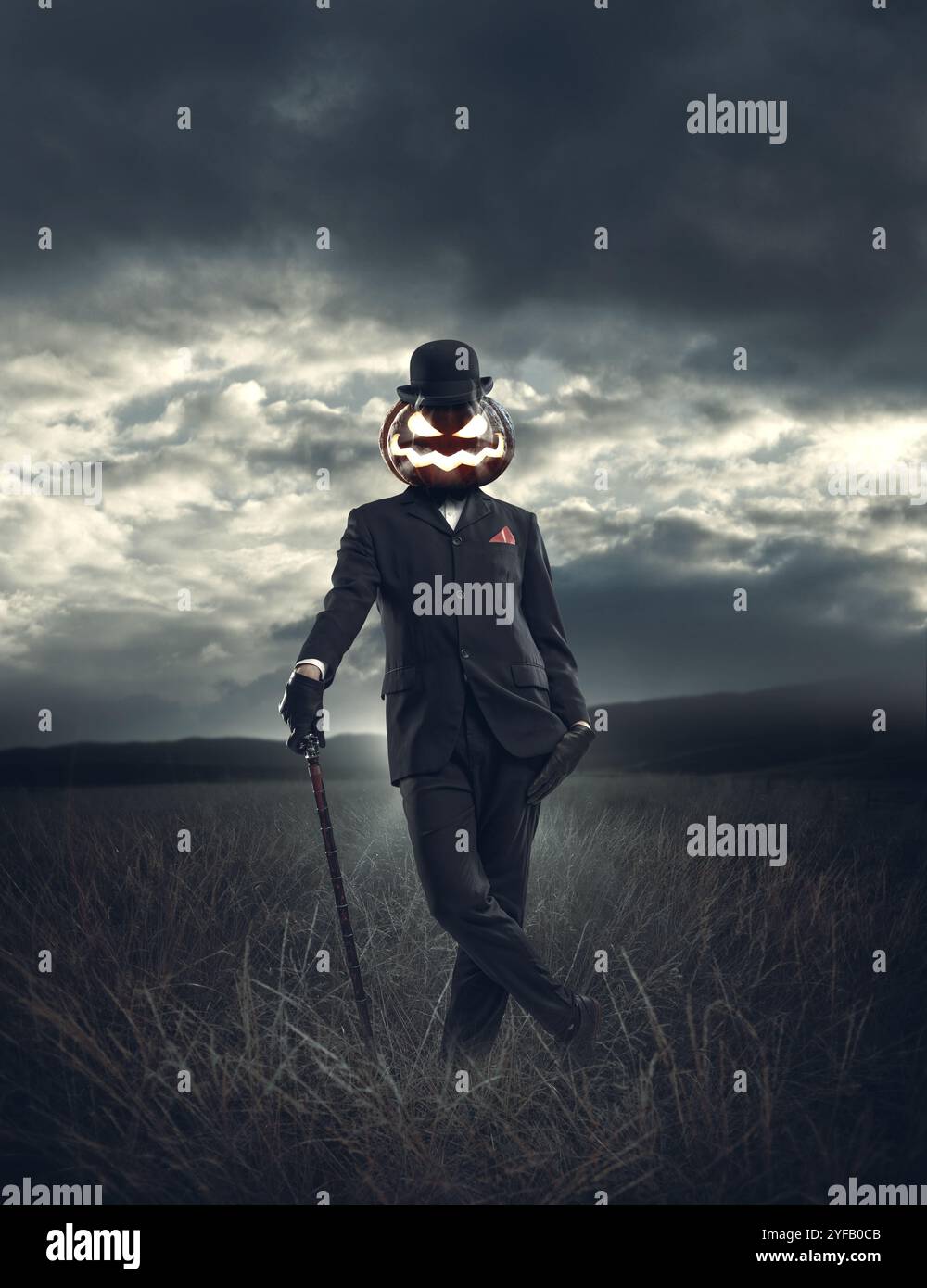 Scary horror Halloween character with pumpkin head standing in the ...