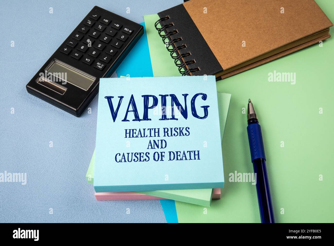 Vaping, health risks and causes of death. Notepad with text on office ...