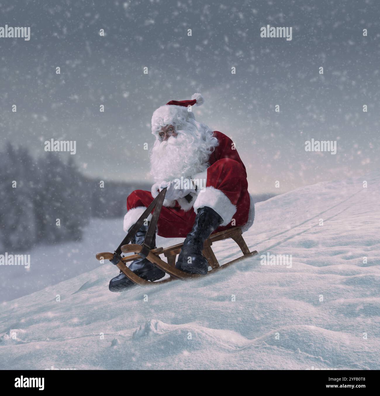 Fast funny Santa Claus riding a small wooden sleigh under the snow ...