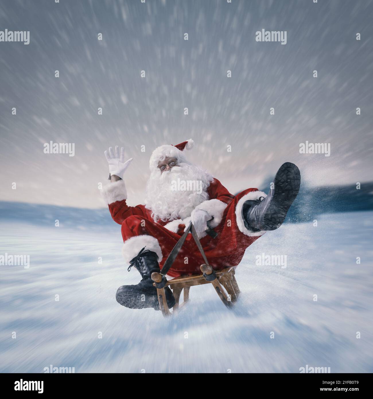 Funny Santa Claus riding a small wooden sleigh under the snow, he is ...