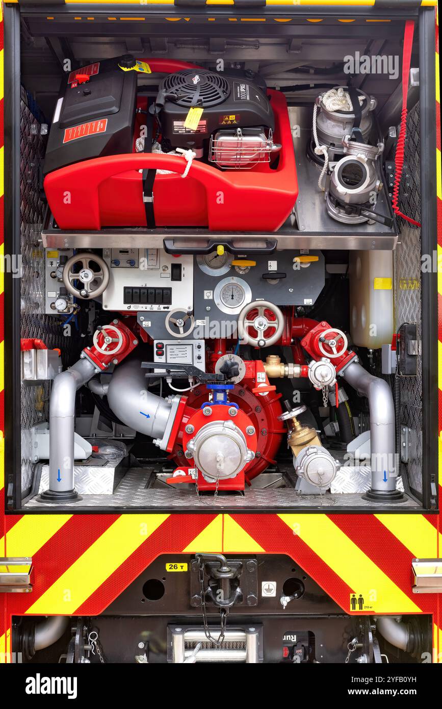 Detailed view of firefighting tools, valves, hoses, and machinery ...