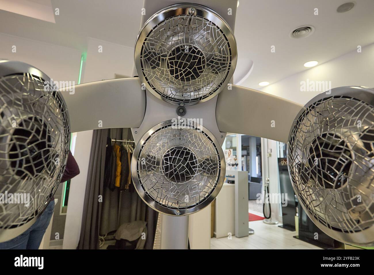 Seated station of a modern hair steamer seen frontally inside a women's ...