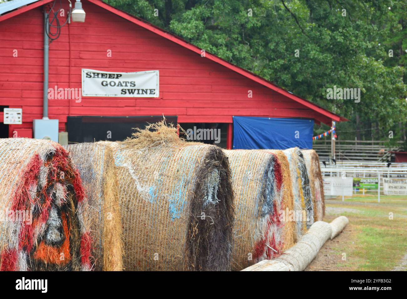 Building at County Fair with Hay Bales Stock Photo - Alamy