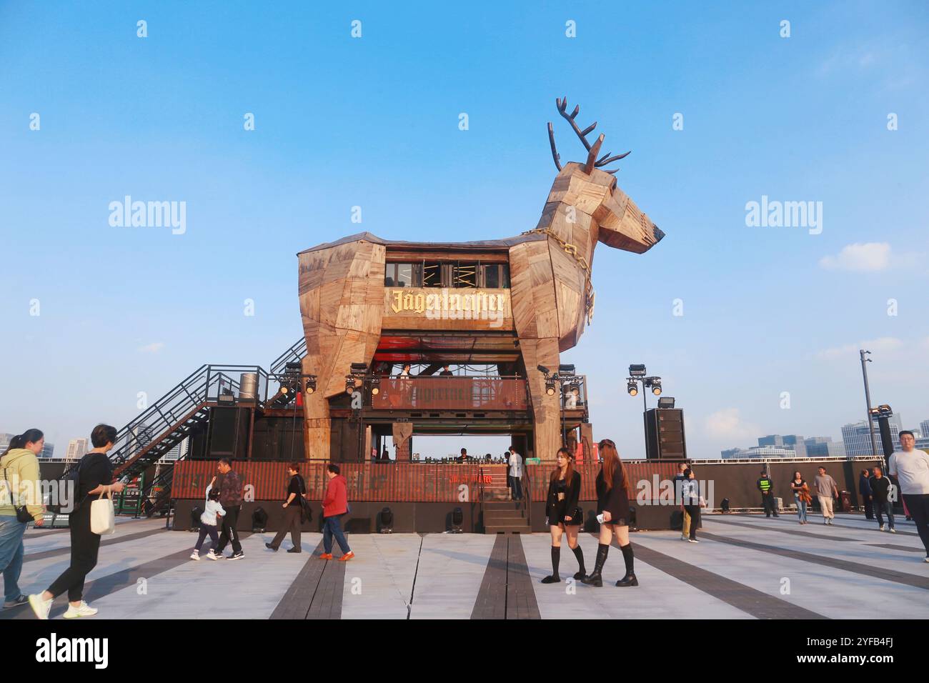 People pass by a 16-meter-tall temporary three-floor structure in the ...