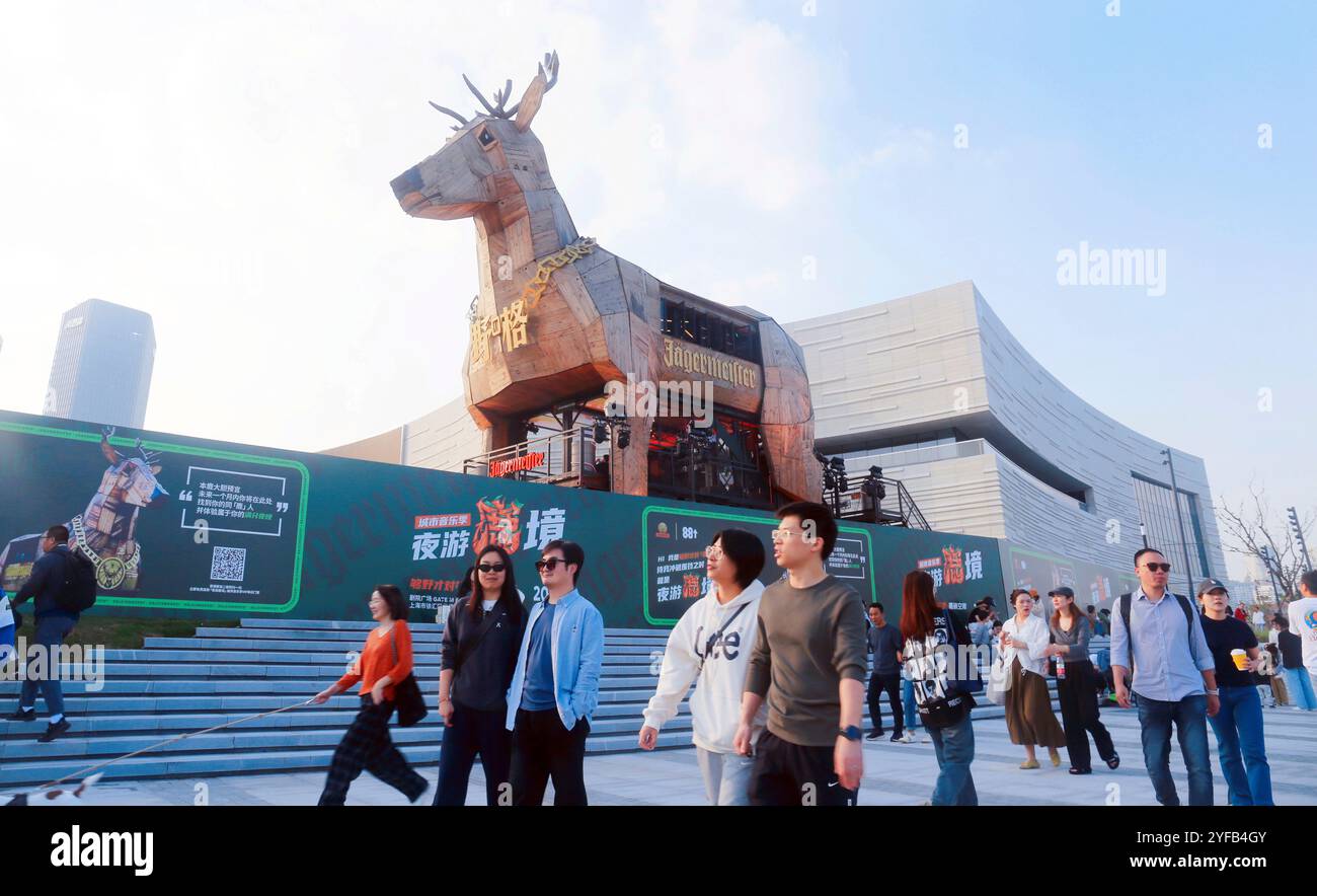 People pass by a 16-meter-tall temporary three-floor structure in the ...
