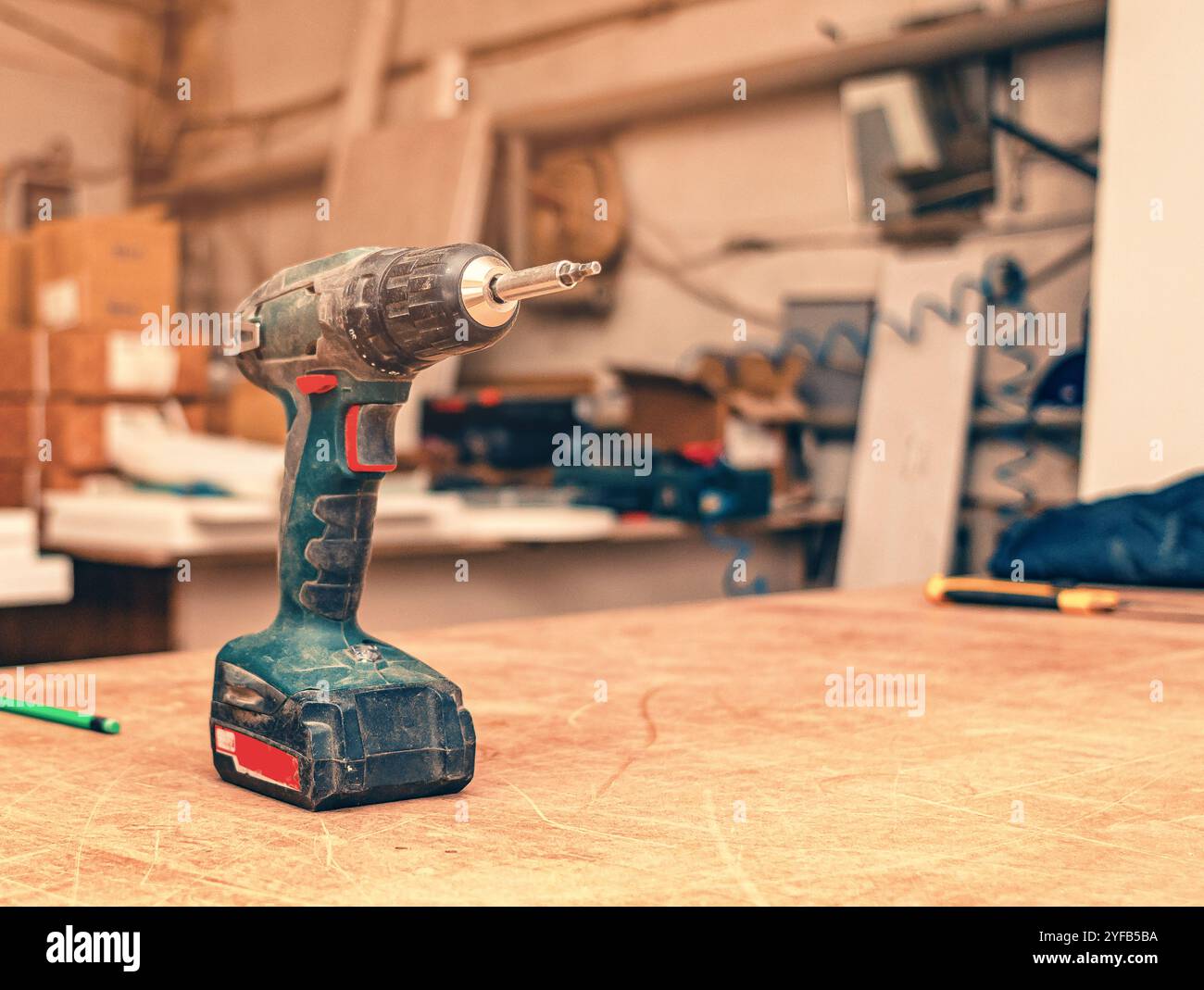 Screwdriver on the table in furniture workshop, production, furniture ...