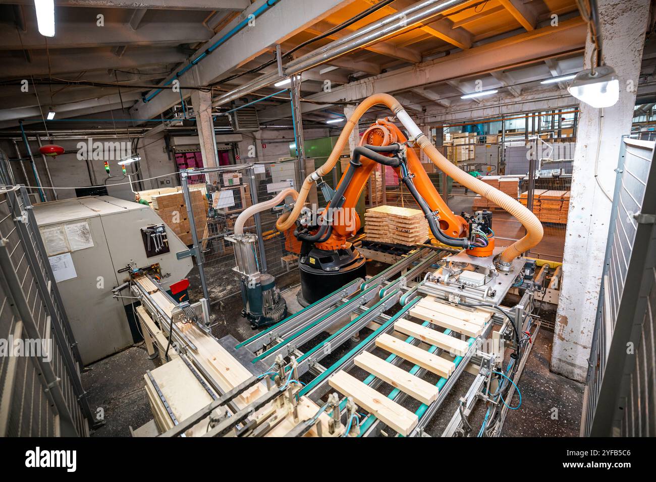 industrial robotic arm in a woodworking factory, highlighting advanced automation in wood ...