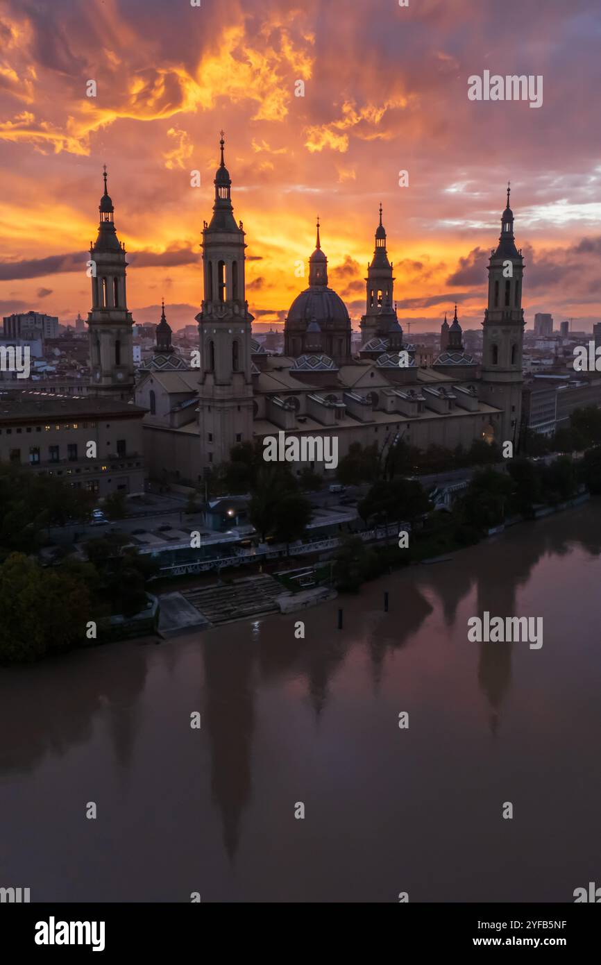 Aerial view of El Pilar Basilica Cathedral and the Ebro River at sunset ...