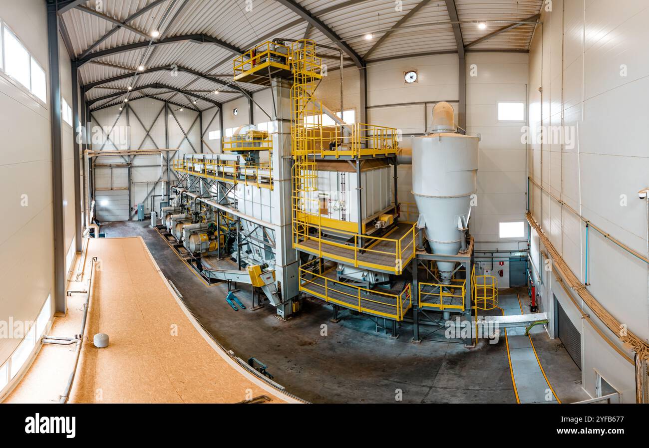 A manufacturing facility with a modern woodworking machine processing ...