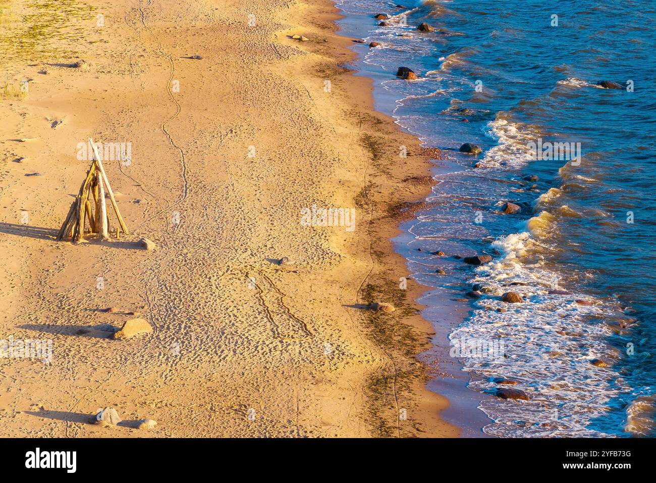 aerial view of a beach with wooden walkways leading through the sand ...