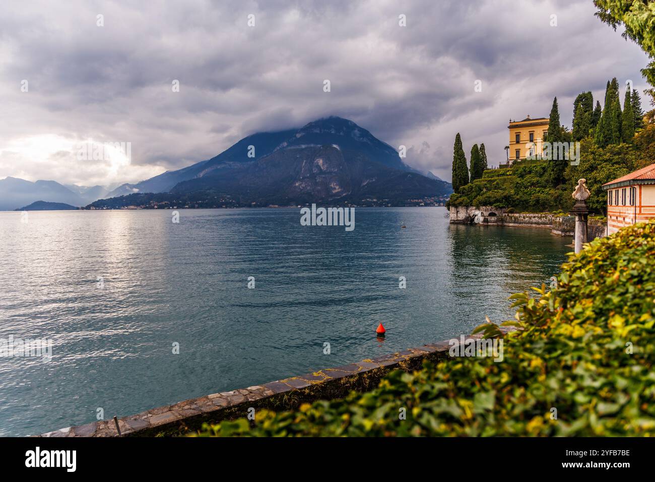 Varena, Italy - September, 2024: Italian village waterside view on Lake ...