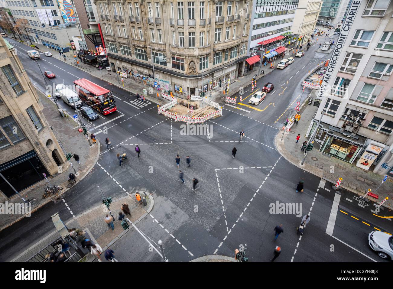04 November 2024, Berlin: Pedestrians cross the Friedrichstraße ...