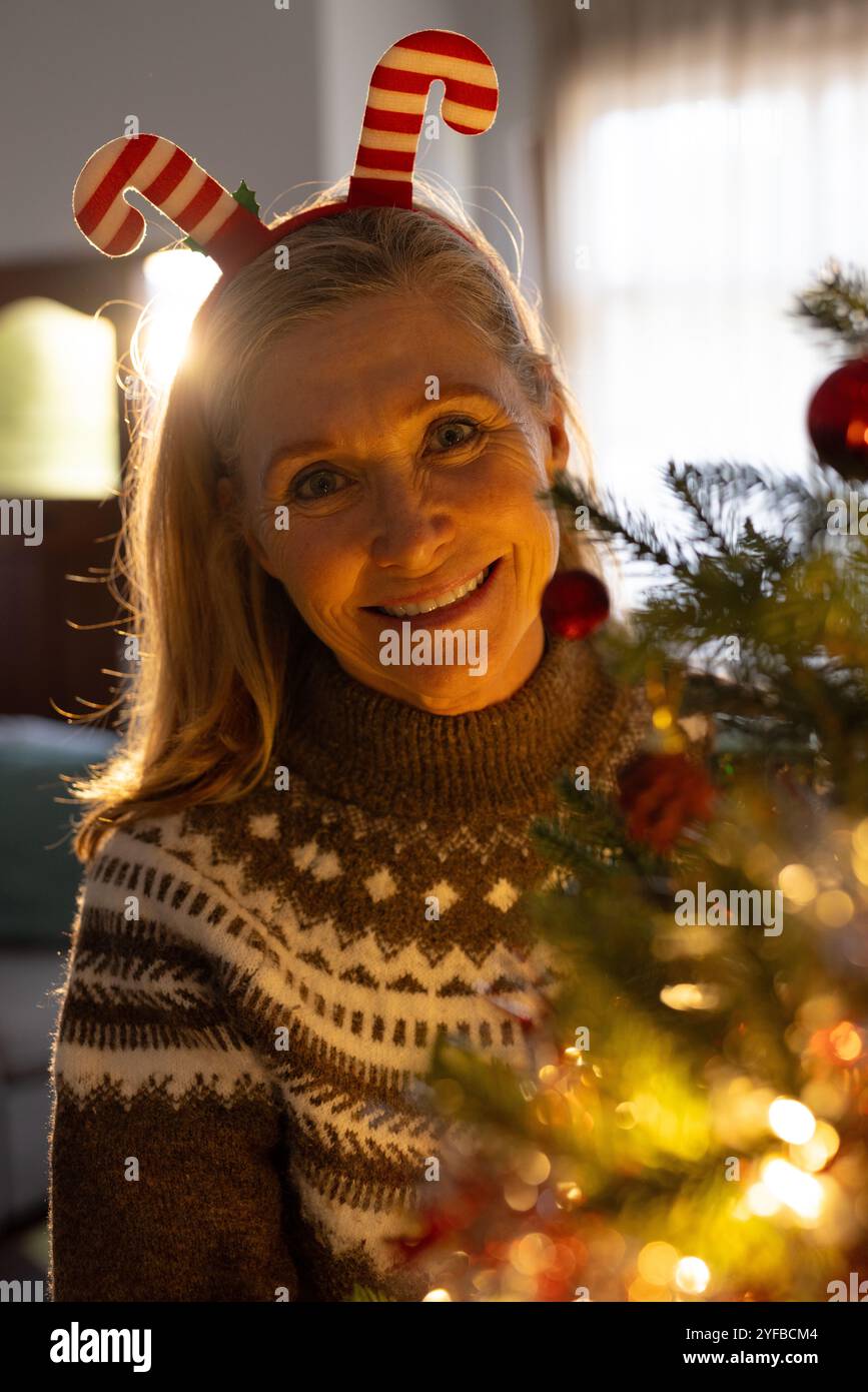 Cheerful elderly woman wearing festive hi-res stock photography and ...