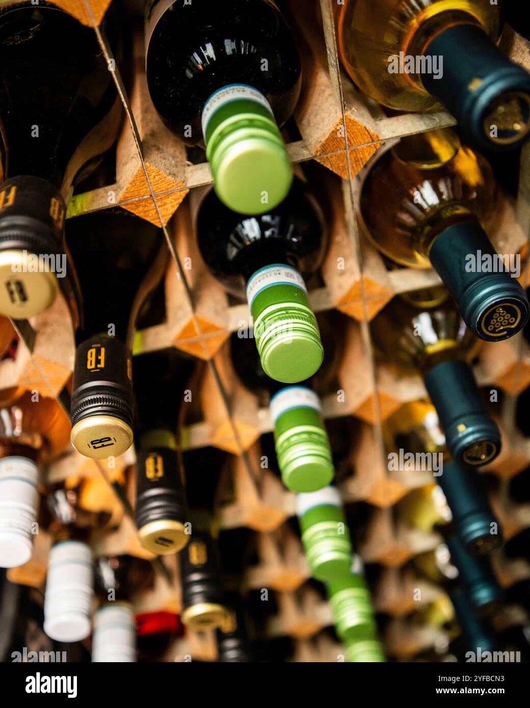 Rows of red and white wine in a modern wooden rack Stock Photo - Alamy