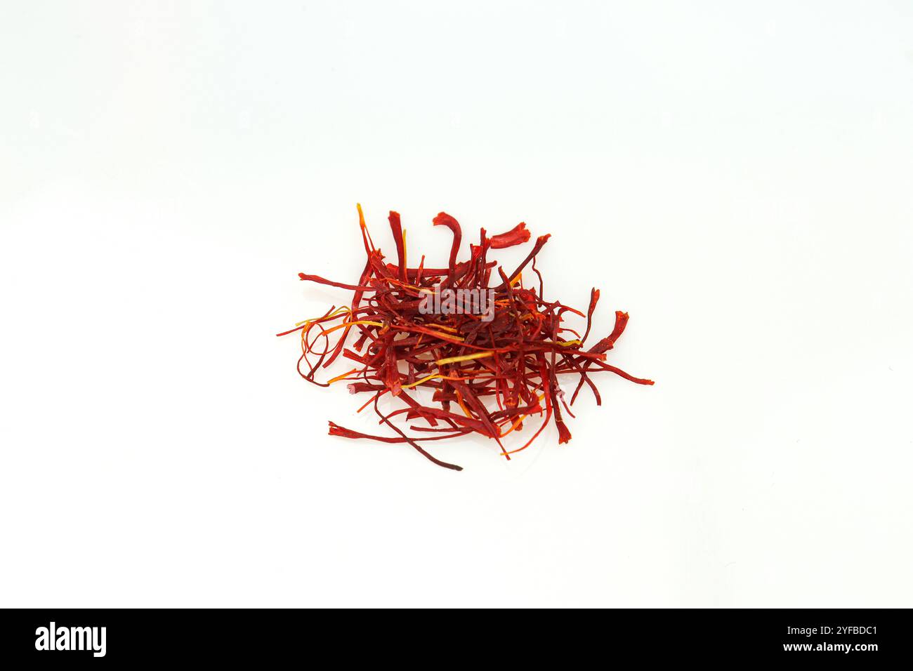 Red saffron pile of condiment isolated on white background Stock Photo ...