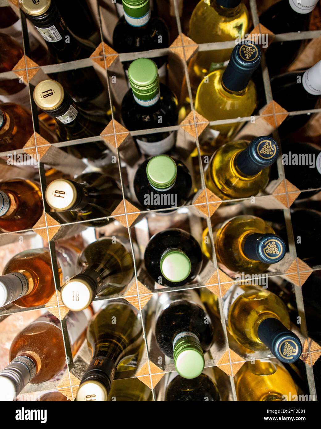 Rows of red and white wine in a modern wooden rack Stock Photo - Alamy