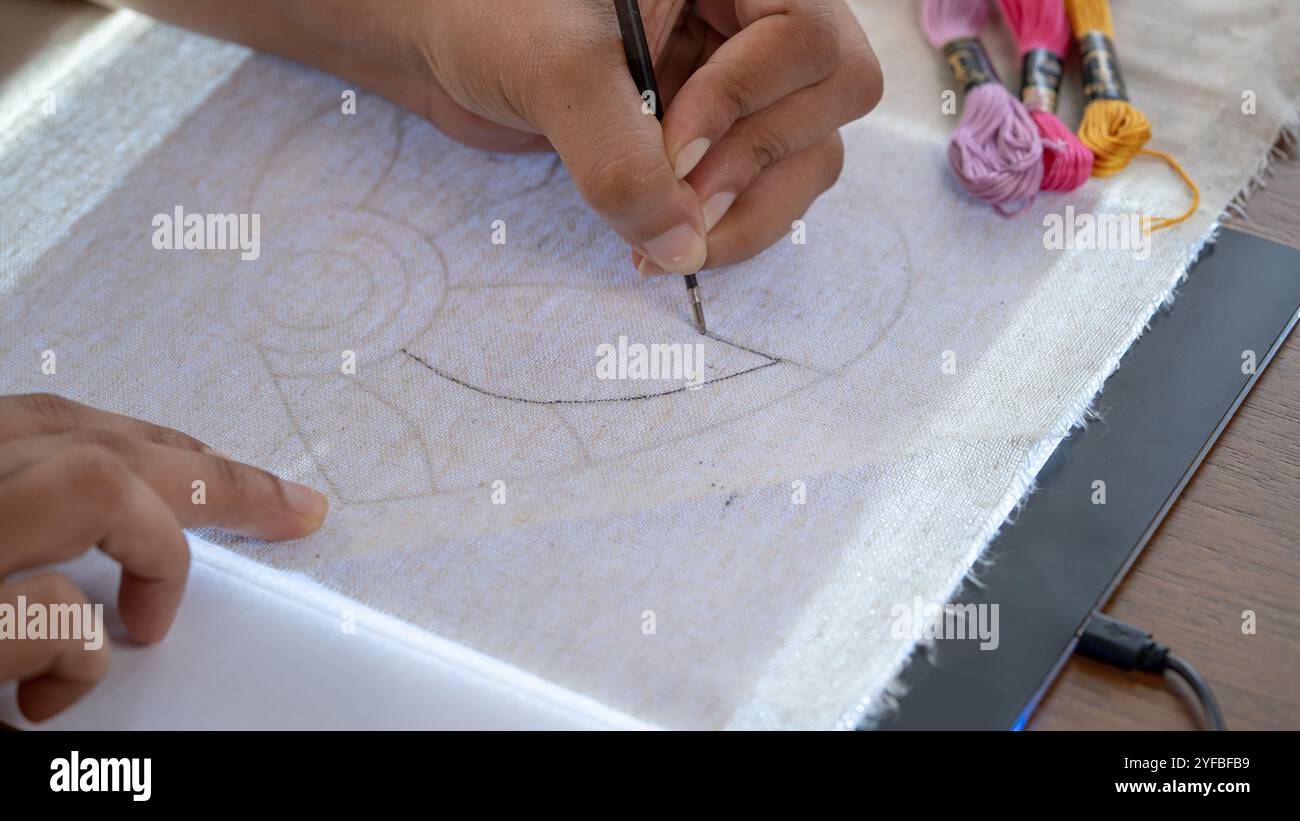 Tracing Designs with LED Light Pad for a Hand Embroidery Project Stock ...