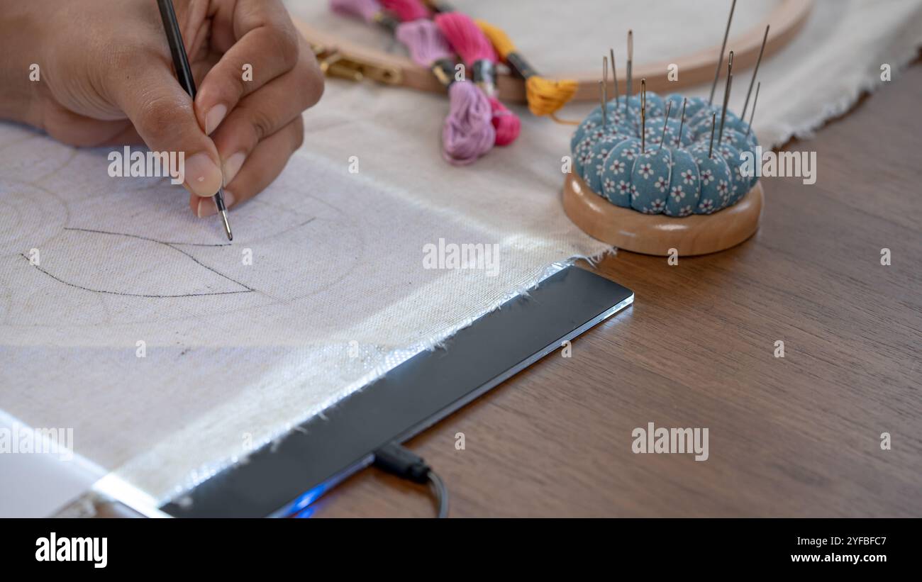Tracing Designs with LED Light Pad for a Hand Embroidery Project Stock ...