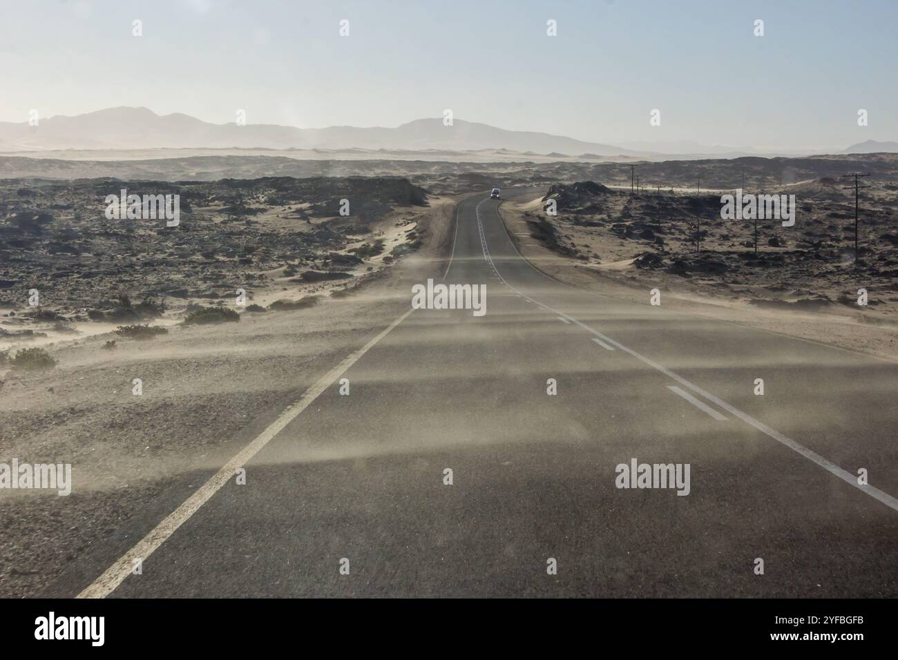 Wind blowing sand over the highway connecting Aus and Lüderitz in the ...