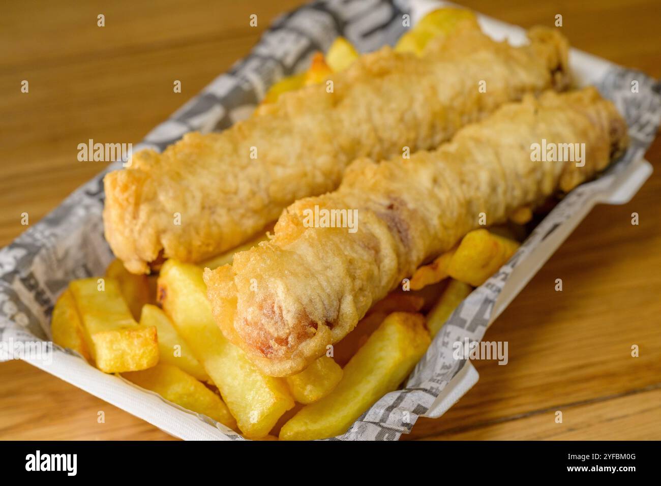 Sausage and chips, sausage supper from chip shop Stock Photo - Alamy