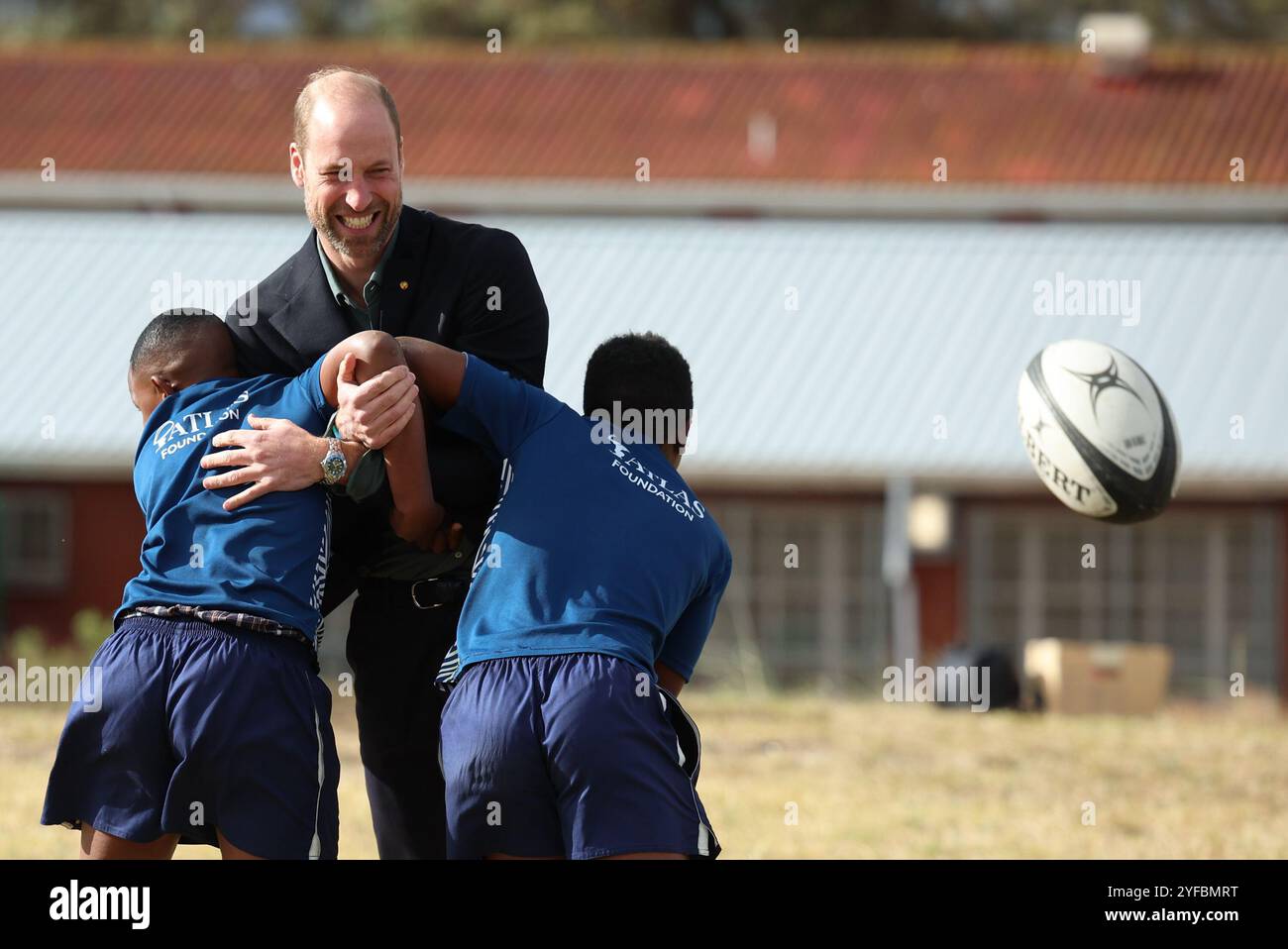 The Prince of Wales takes part in a rugby coaching session, during a ...