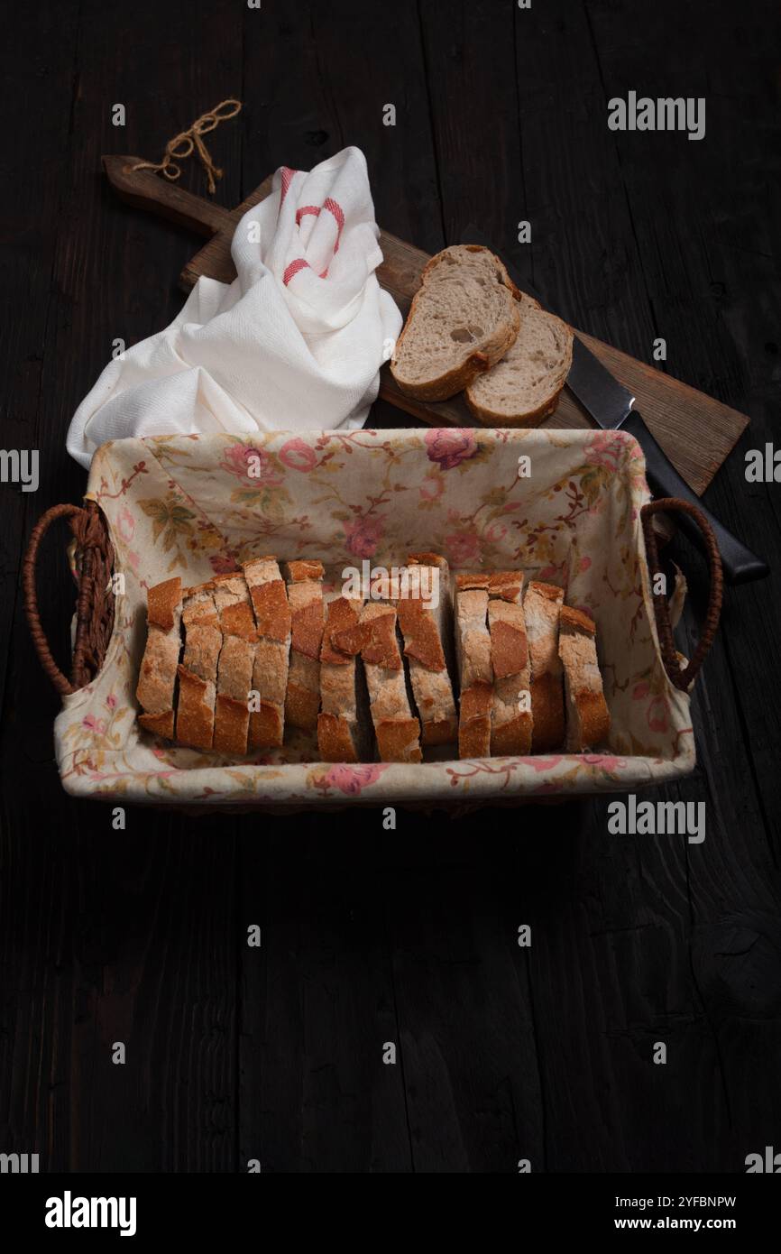 Rustic Bread Display with Sliced Whole Grain Loaf in Wicker Basket on ...