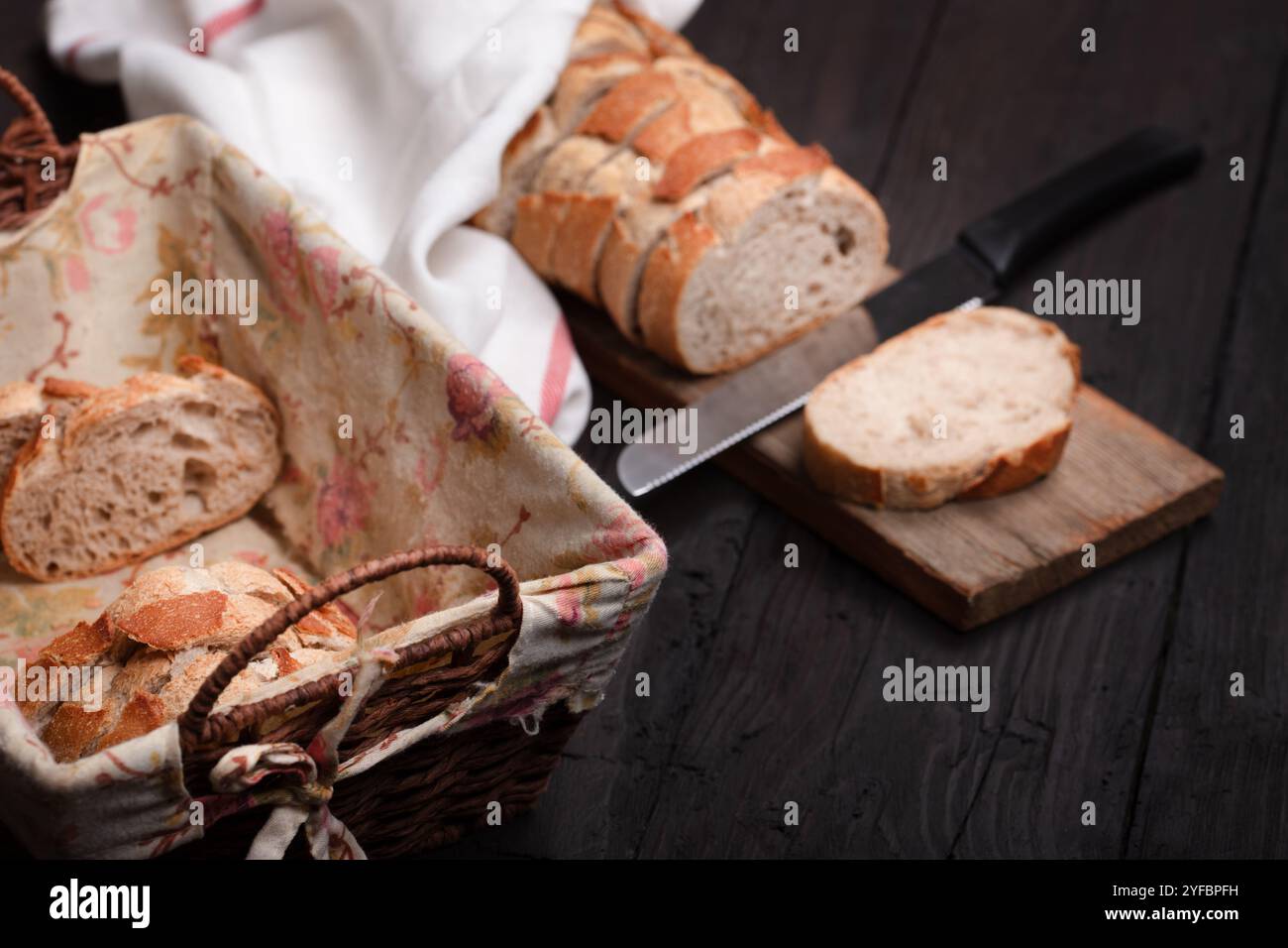 Rustic Bread Display with Sliced Whole Grain Loaf in Wicker Basket on ...