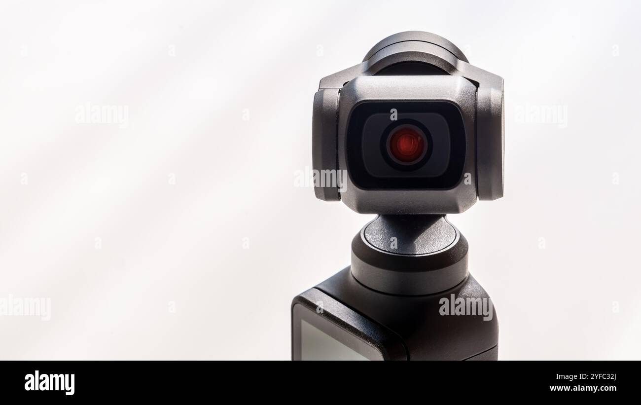 Portable gimbal camera on white background. Big brother watching you ...