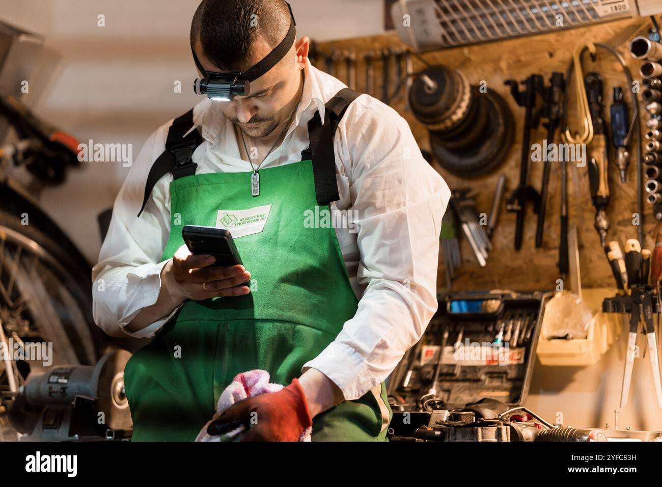 Mechanic in green overalls hi-res stock photography and images - Alamy