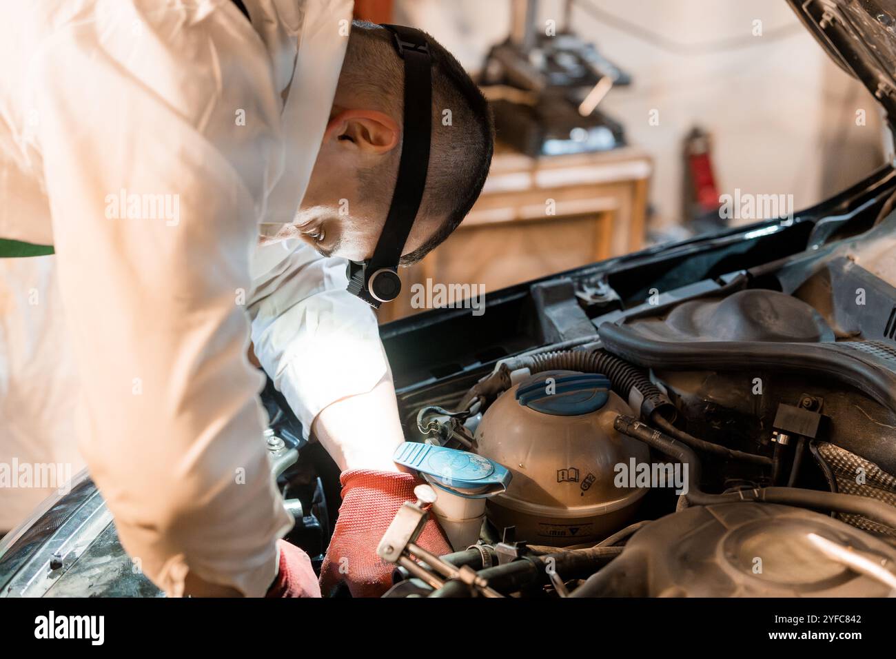Mechanic Performing Engine Maintenance with Precision and Care Stock ...