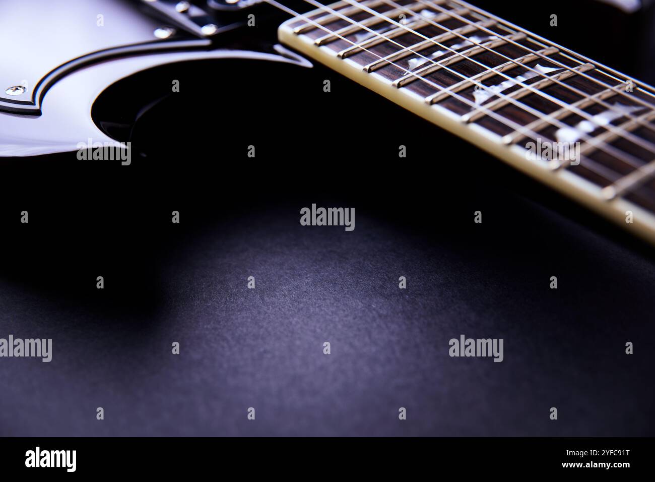 Fretboard of modern electric guitar. Close up Stock Photo - Alamy