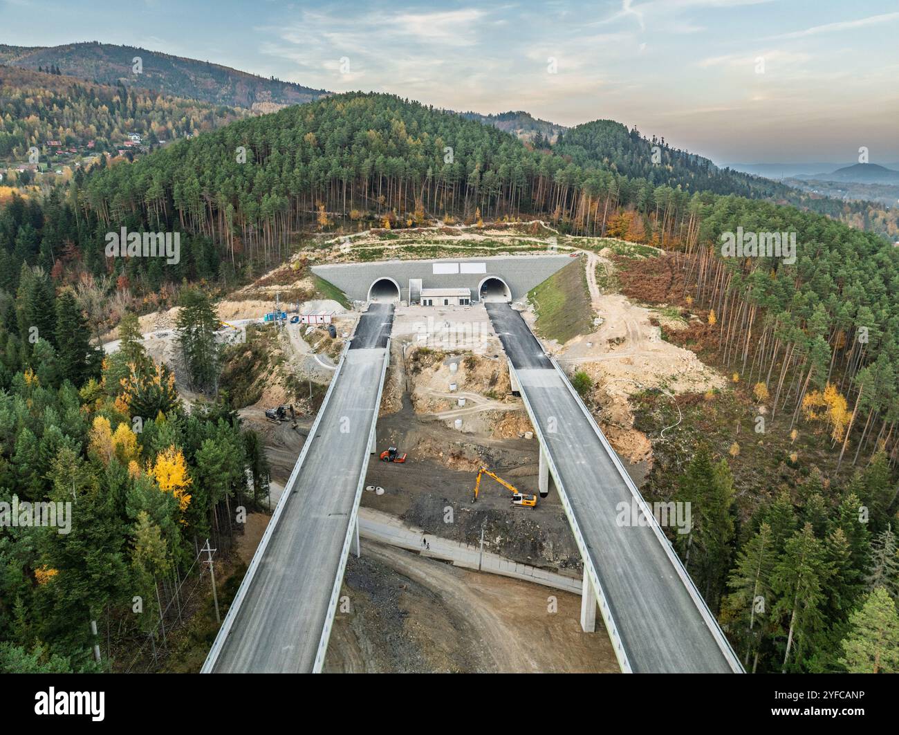 Aerial drone view of unfinished highway construction site in mountains ...