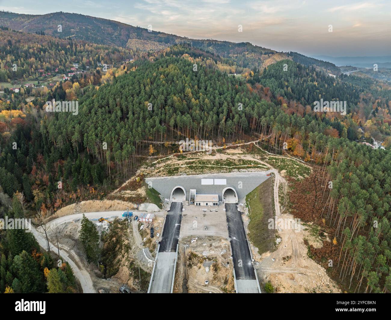 Aerial drone view of unfinished highway construction site in mountains ...