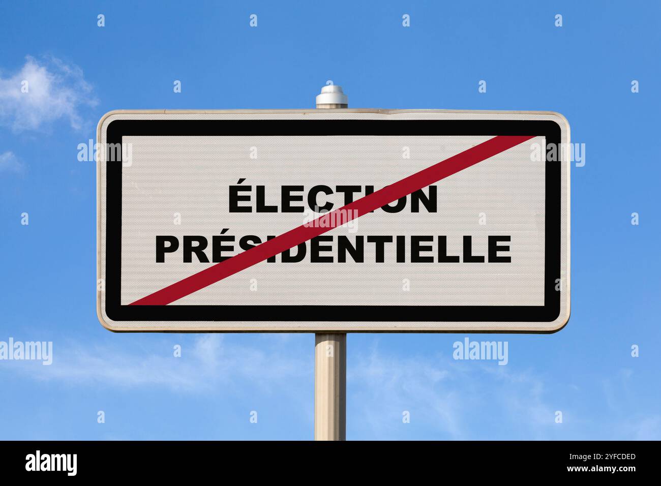 A French exit city sign against a blue sky with written in the middle ...
