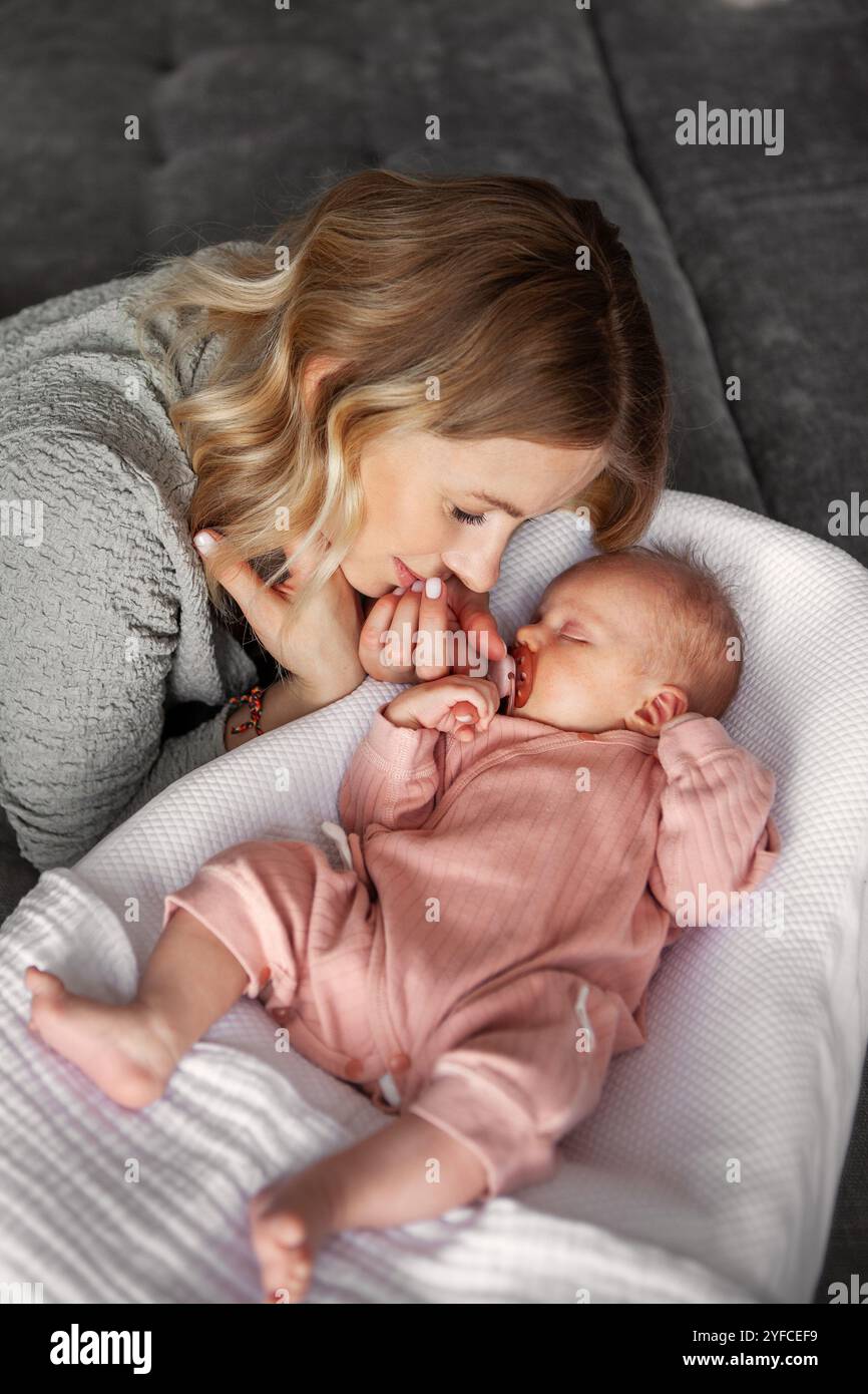 Newborn baby dressed in soft hi-res stock photography and images - Alamy