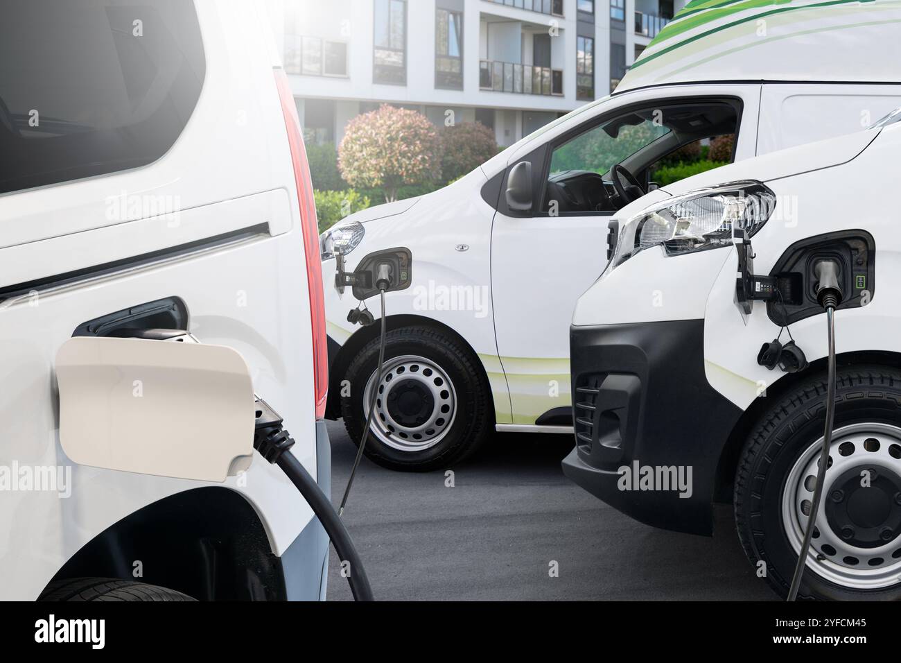 Electric delivery van with connected charging cable Stock Photo - Alamy