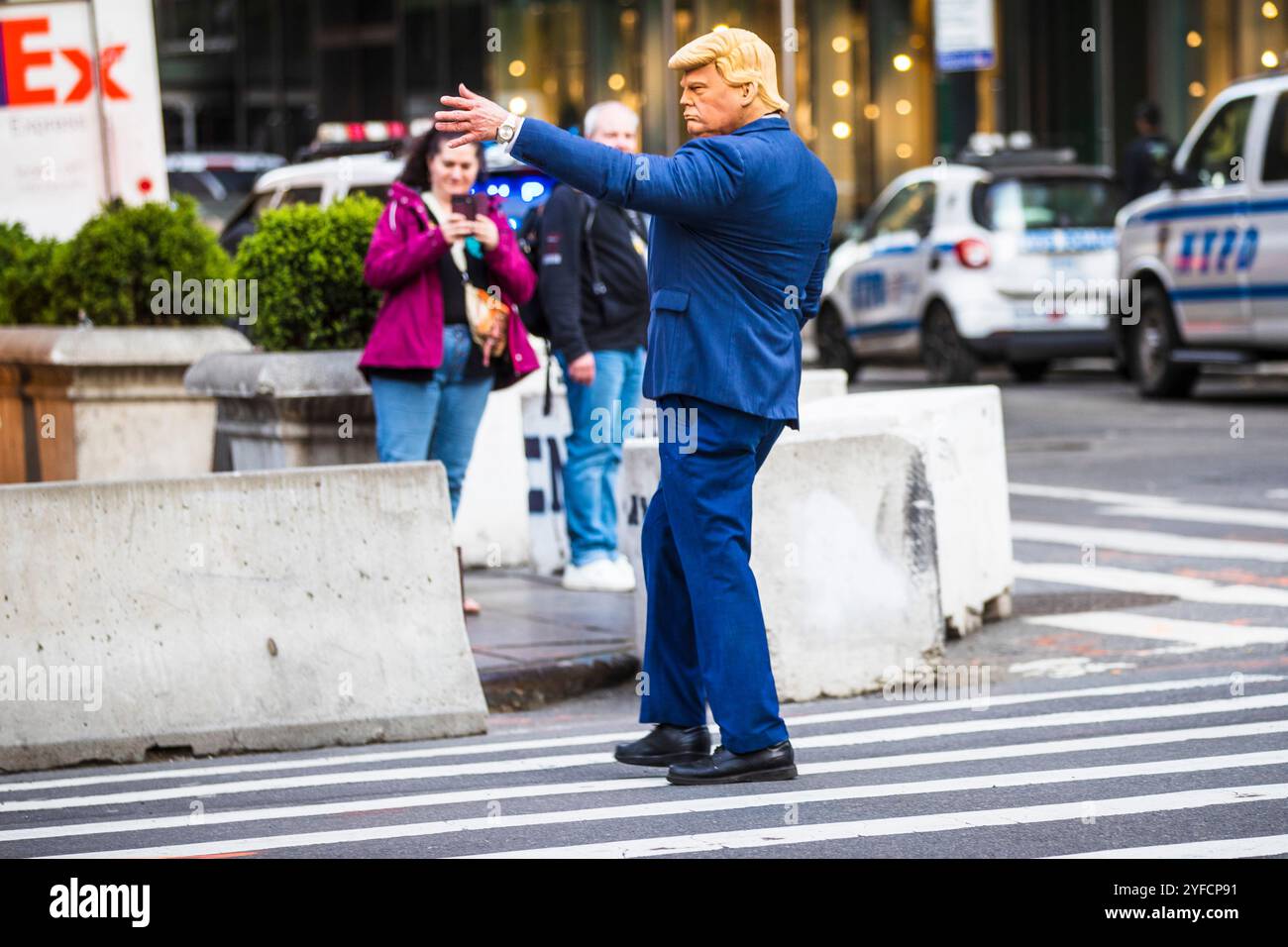 A person in a Donald Trump costume giving a thumbs-up gesture on the ...