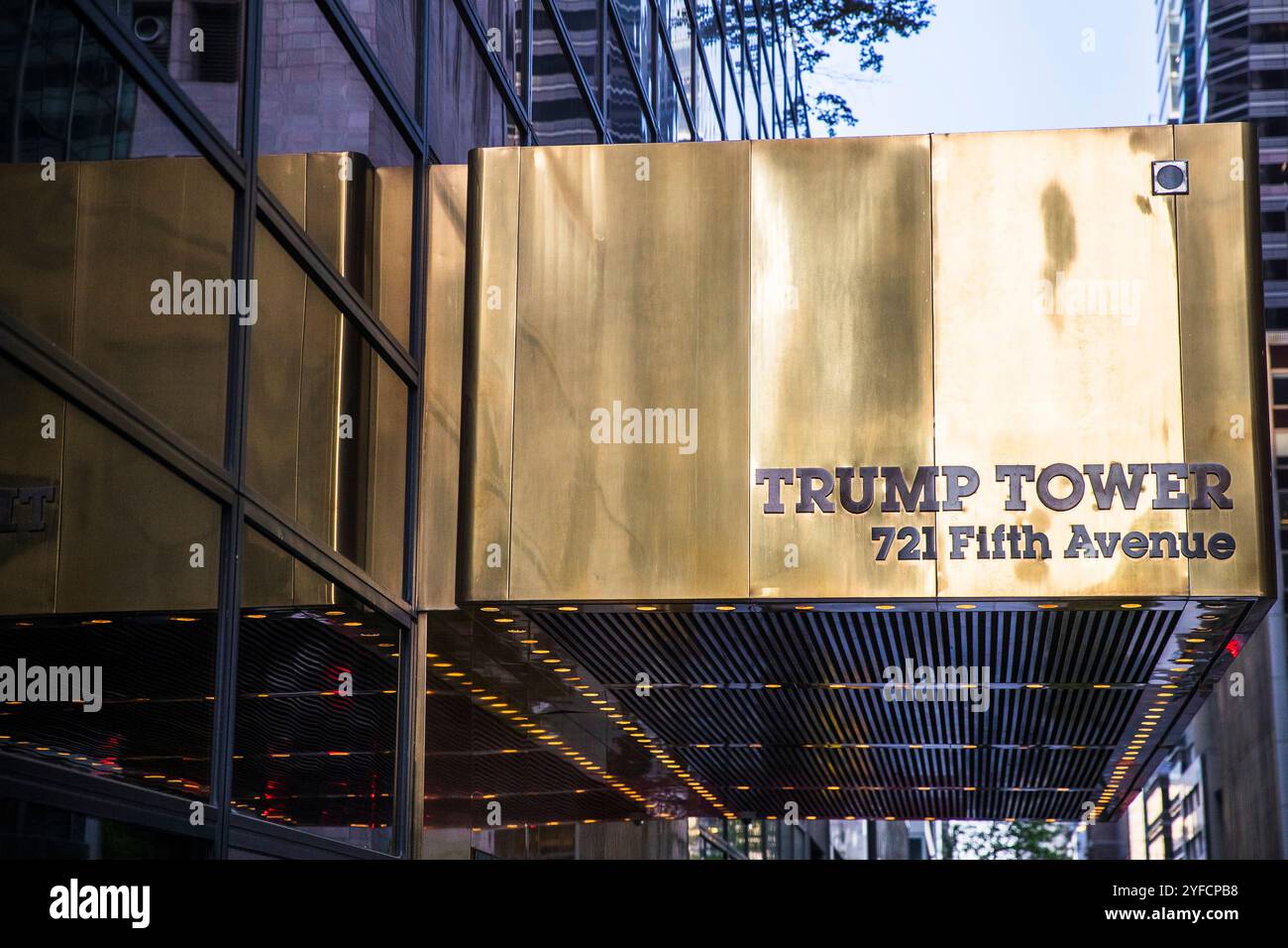 The entrance of Trump Tower in New York City, featuring a clock and a ...