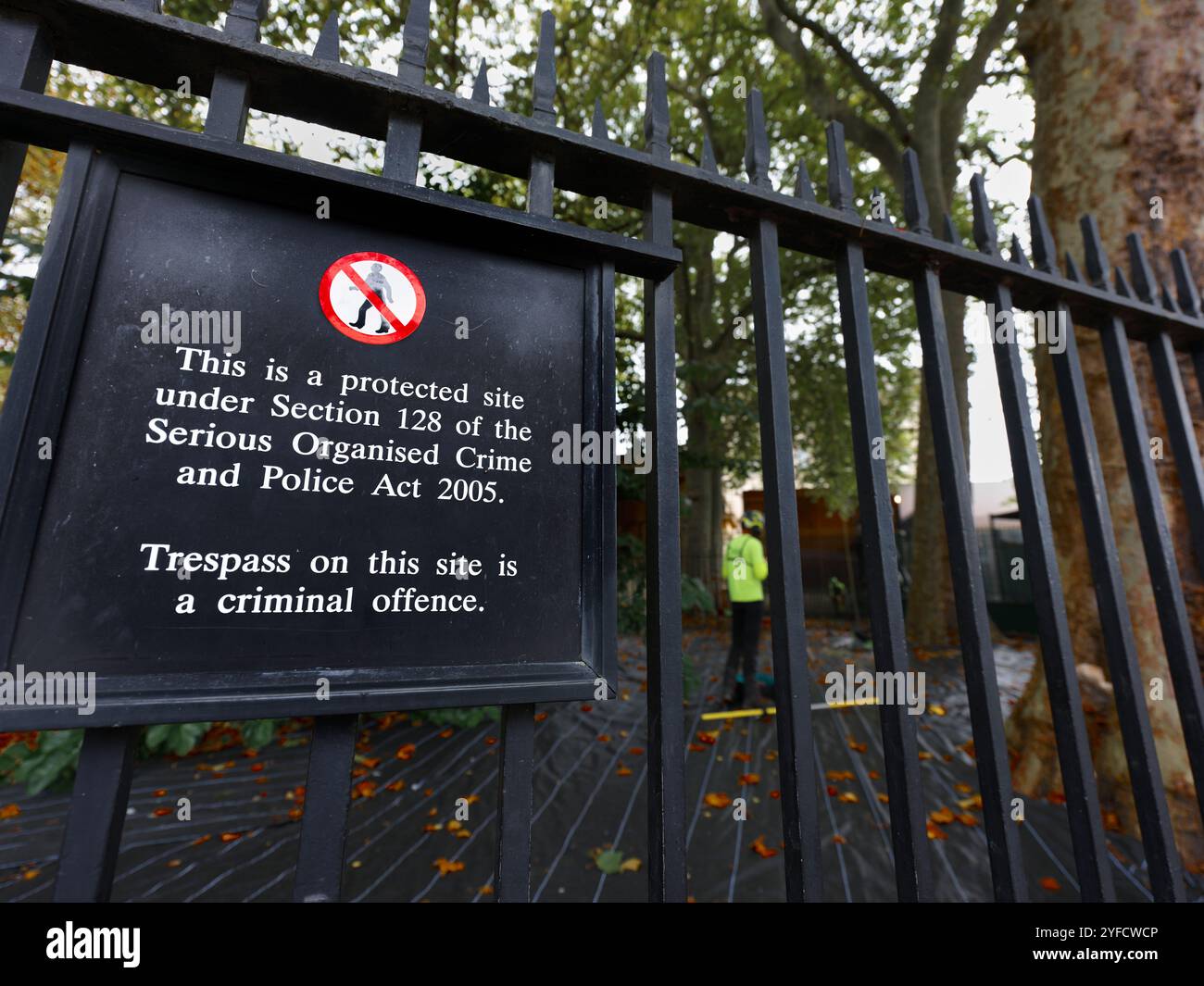 Warning, about trespass as a criminal offence, on a railing outside ...