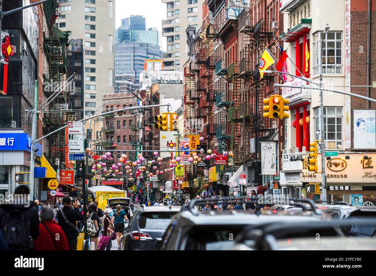 A bustling street scene in Chinatown, New York City, featuring colorful ...