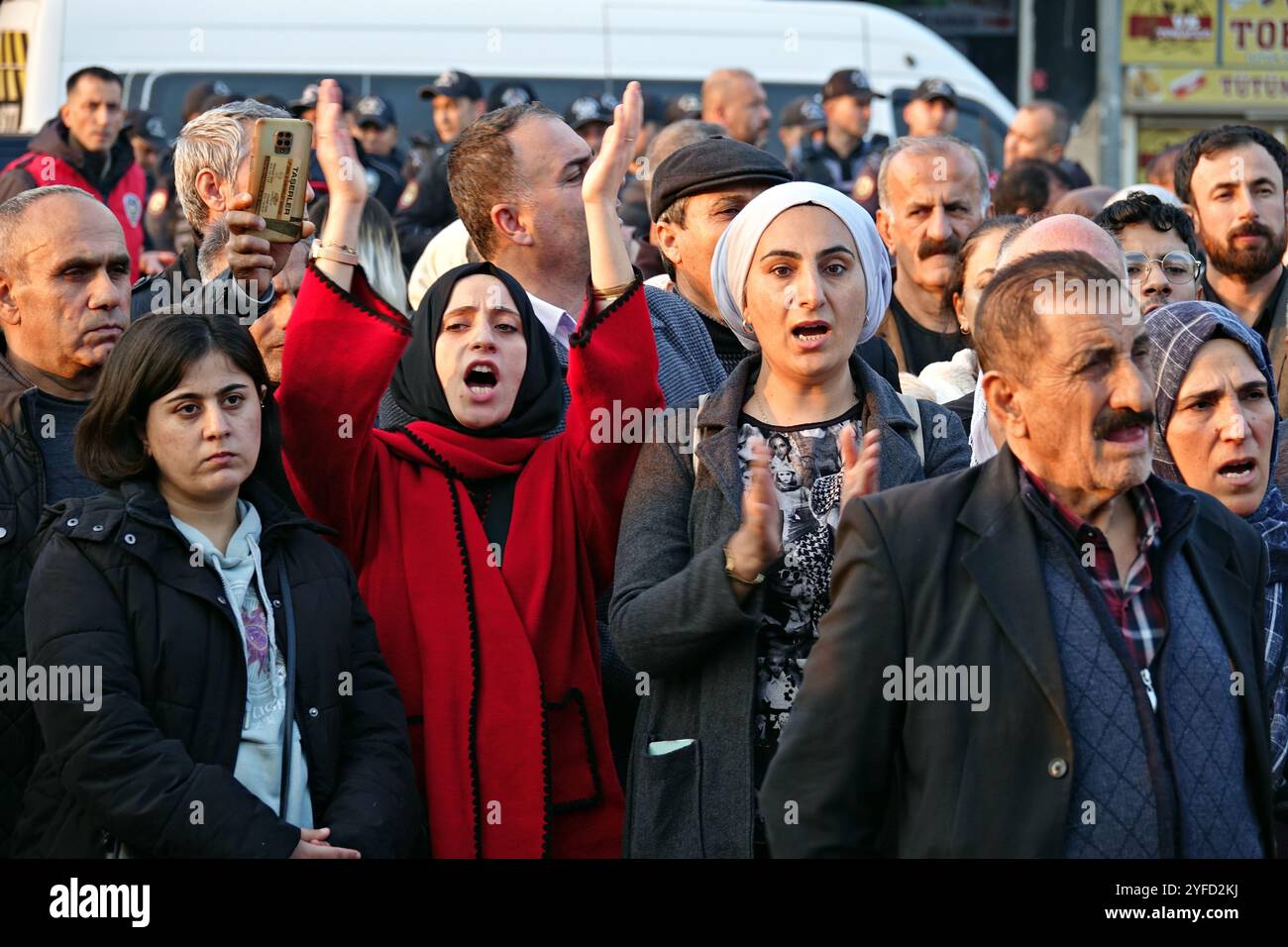Protesters chant slogans and clap during a demonstration in Diyarbakir ...
