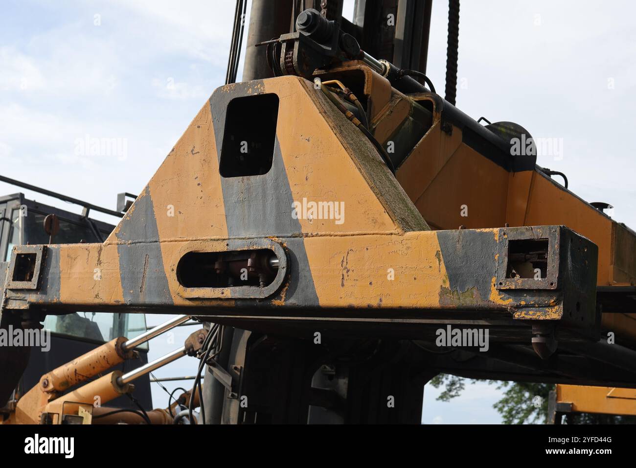 Detailed view of a yellow reach stacker lifting arm, showcasing its ...