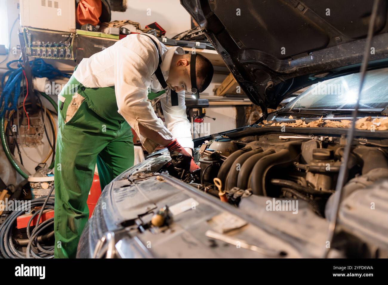 Professional mechanic performing car maintenance hi-res stock ...