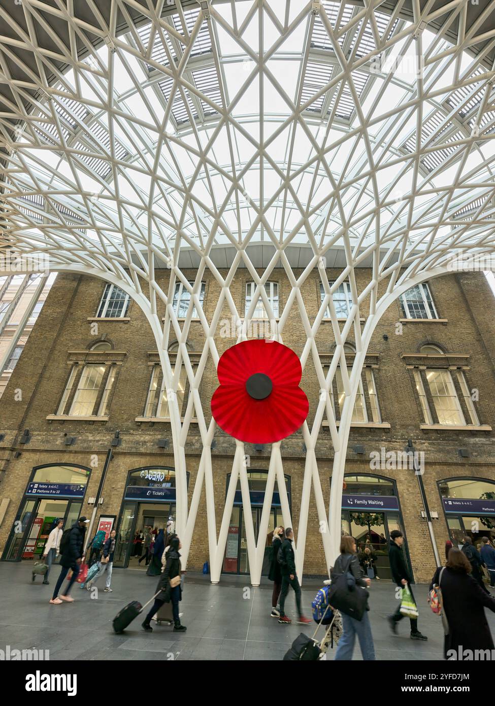 Poppy dominates passengers in concourse at King's Cross rail station ...