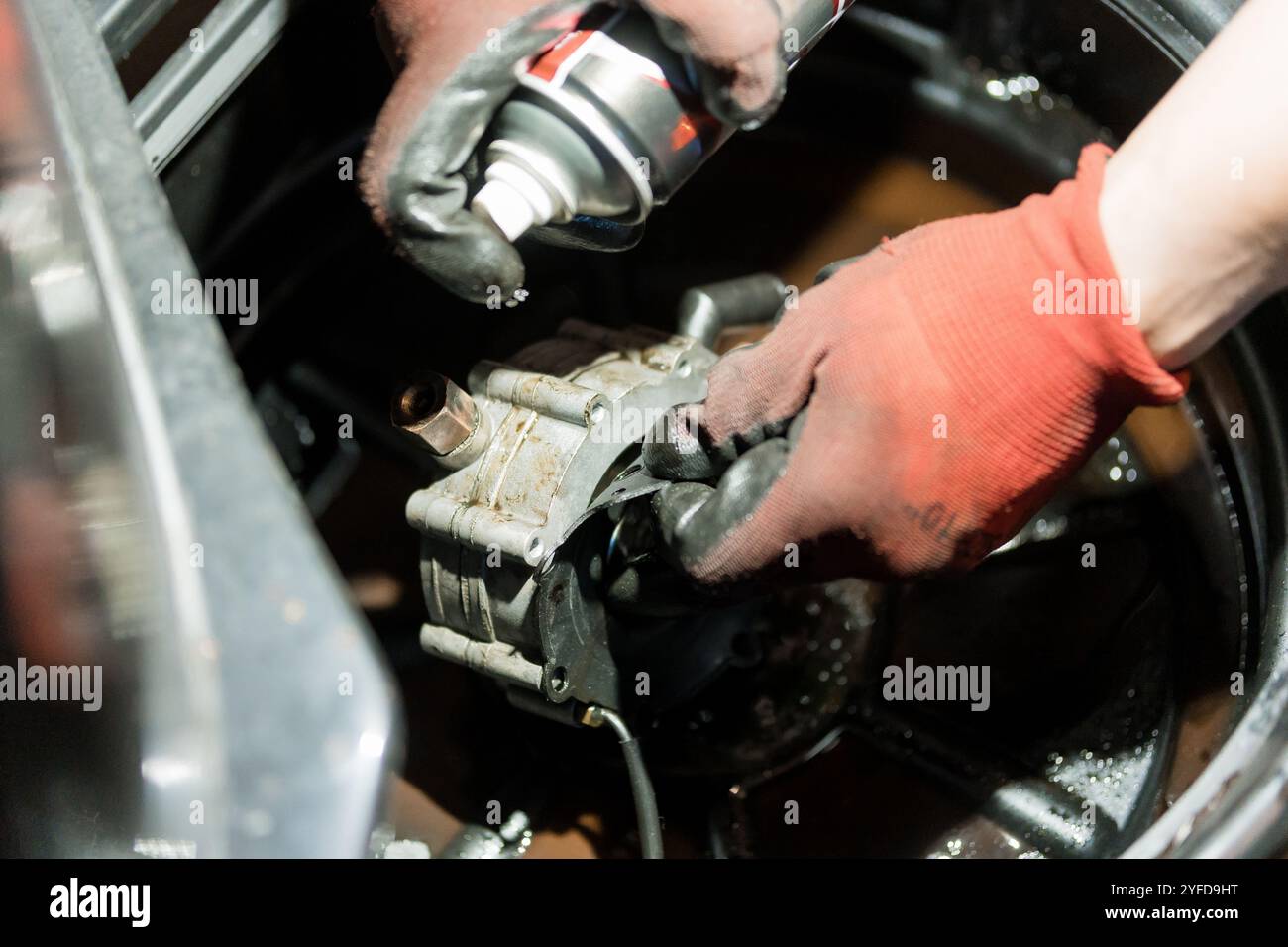 Mechanic Disassembling an Engine Component with Grease-Stained Gloves ...