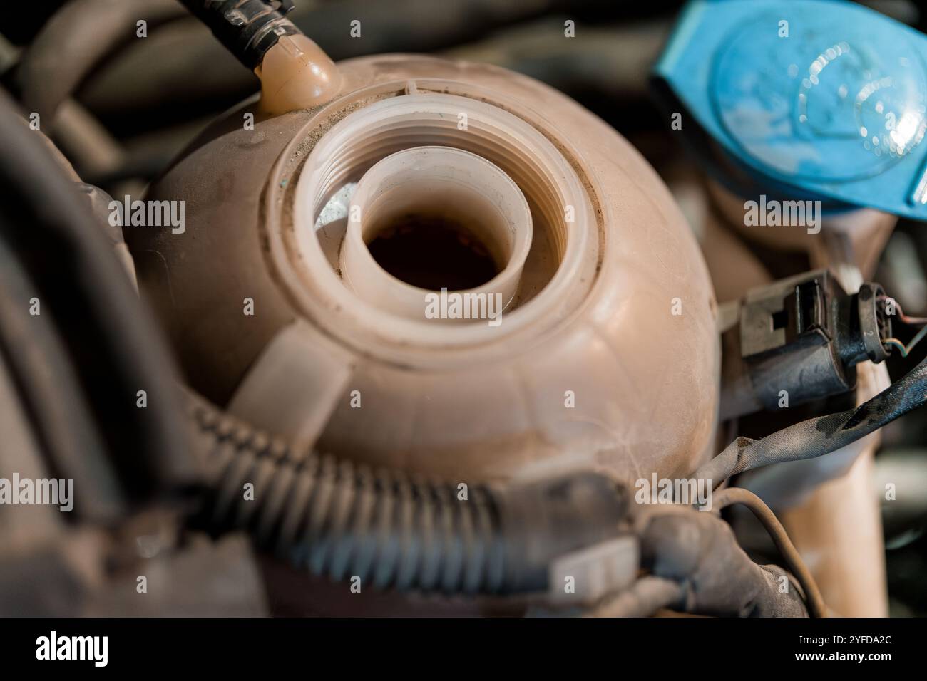 Close-Up View of a Car's Cooling System Reservoir with Fluid Inside ...