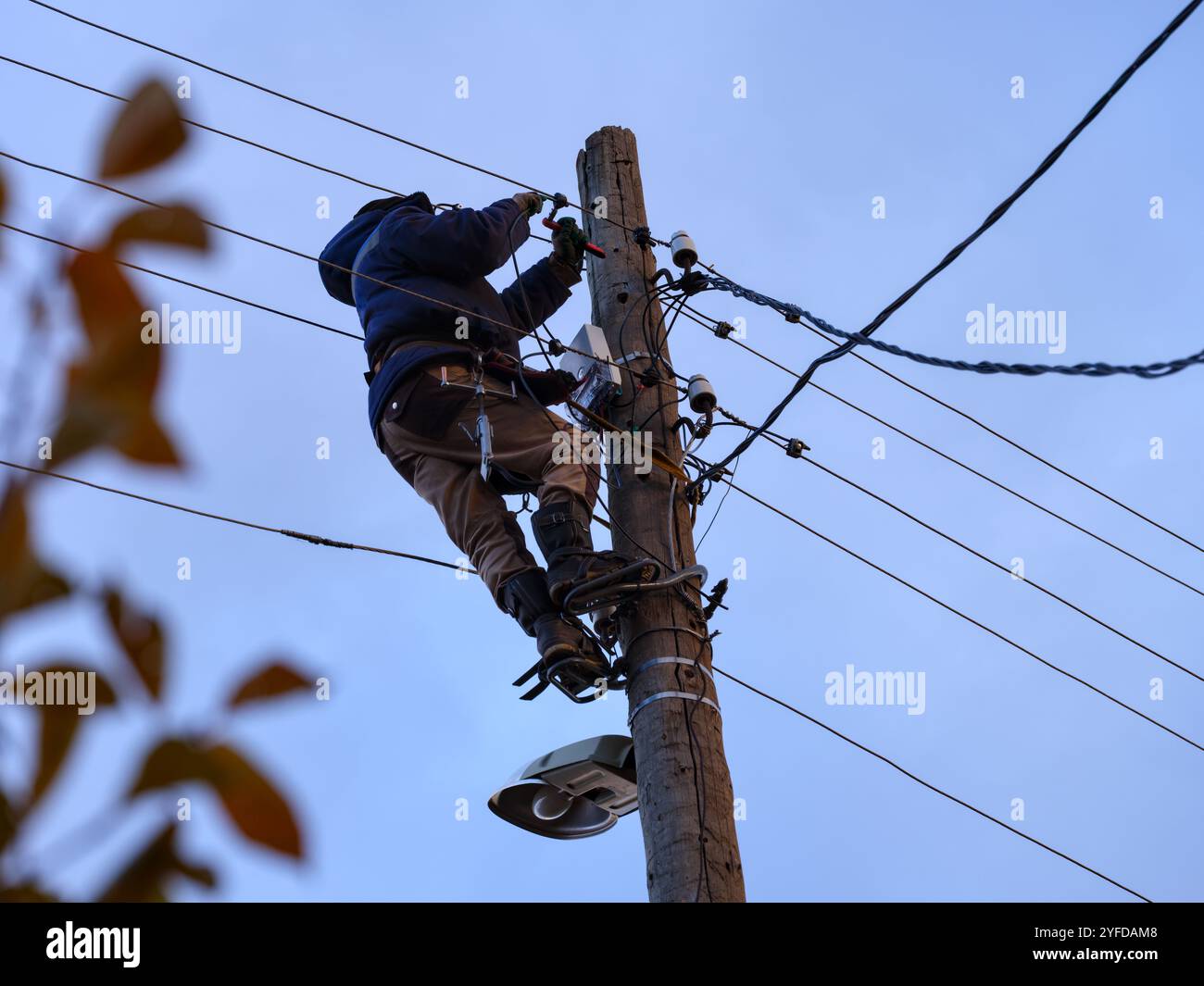 Man working on electrical wire hi-res stock photography and images - Alamy